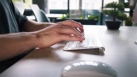 A man typing on a computer, using modern... | Stock Video | Pond5