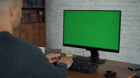 Man Typing on Keyboard and Looking at Gr... | Stock Video | Pond5