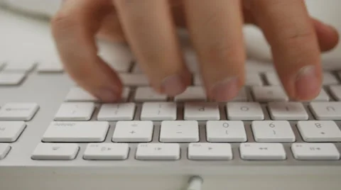 Man Typing on White Keyboard - 4k | Stock Video | Pond5