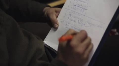 Man underline words in list on sheet of ... | Stock Video | Pond5