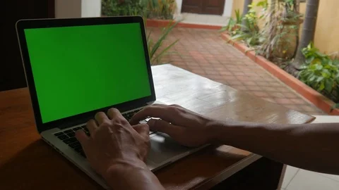Man use laptop at home with Green Screen... | Stock Video | Pond5
