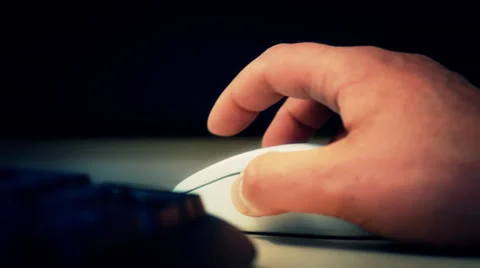 Man uses a computer mouse and types on a... | Stock Video | Pond5