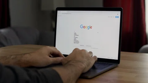 A man uses Google to search for “Lion ... | Stock Video | Pond5