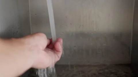 A man uses a washbasin in a public toile... | Stock Video | Pond5