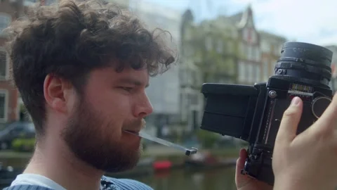 Man Using Classic Analog Camera In Amste... | Stock Video | Pond5