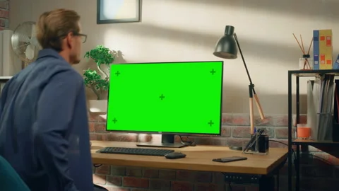 Man Using Computer with Green Screen in ... | Stock Video | Pond5