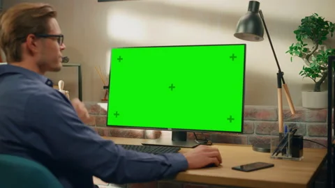 Man Using Computer with Green Screen in ... | Stock Video | Pond5