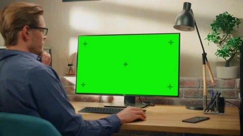 Man Using Computer with Green Screen in ... | Stock Video | Pond5