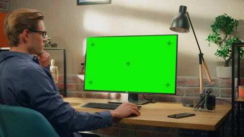 Man Using Computer with Green Screen in ... | Stock Video | Pond5