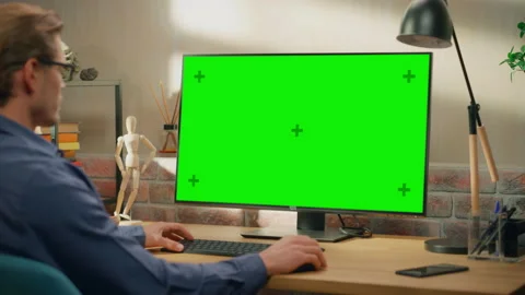 Man Using Computer with Green Screen in ... | Stock Video | Pond5