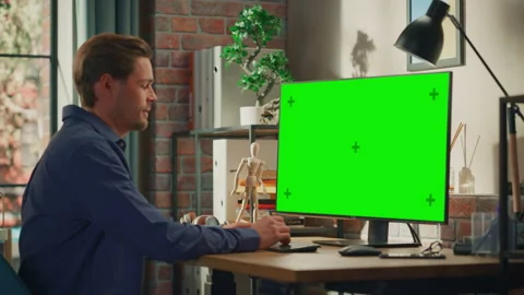 Man Using Computer with Green Screen in ... | Stock Video | Pond5