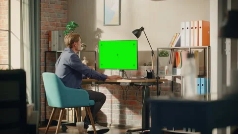Man Using Computer with Green Screen in ... | Stock Video | Pond5