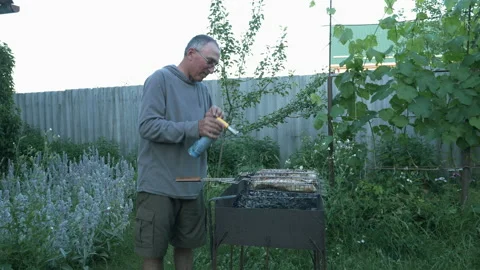 Man using gas spray for fire flames in g... | Stock Video | Pond5