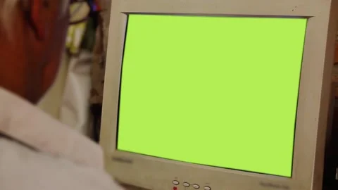 A Man Using an Old Computer with Green S... | Stock Video | Pond5