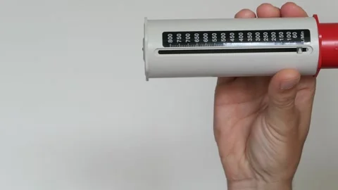 Man using PEF asthma test to measure air... | Stock Video | Pond5