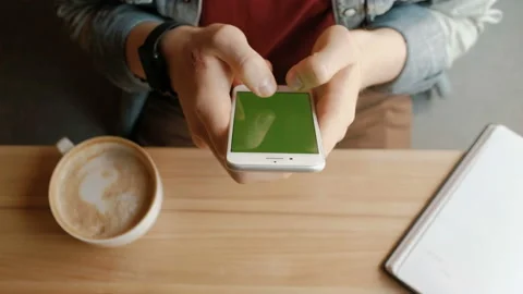 Man using smart phone with green screen | Stock Video | Pond5