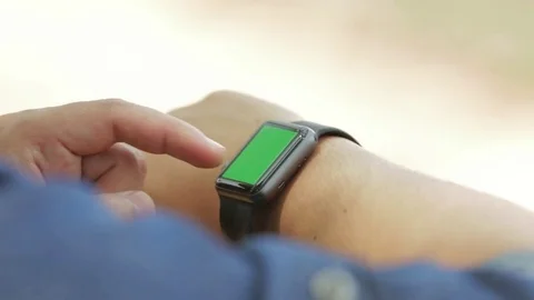 Man using smartwatch with green screen | Stock Video | Pond5