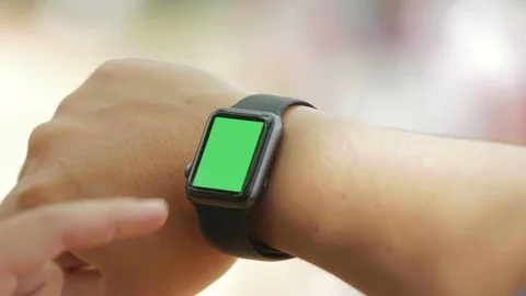Man using smartwatch with green screen | Stock Video | Pond5