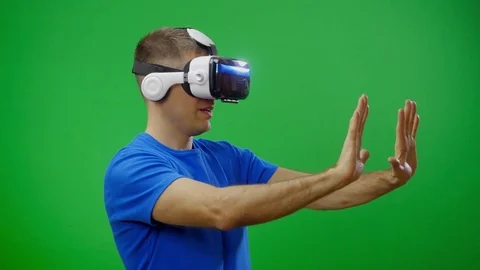 Man in a virtual reality mask looks arou... | Stock Video | Pond5