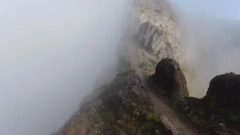 Man Walking Along Narrow Path On Misty M... | Stock Video | Pond5