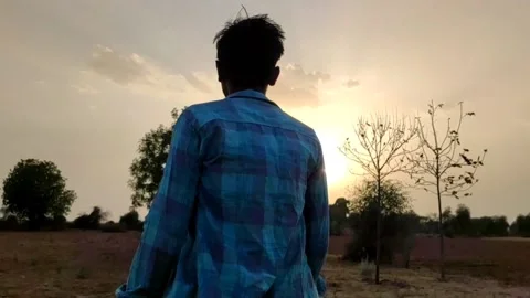 a man walking backside view with sunset ... | Stock Video | Pond5