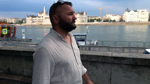 Man walking in Budapest city, super slow... | Stock Video | Pond5