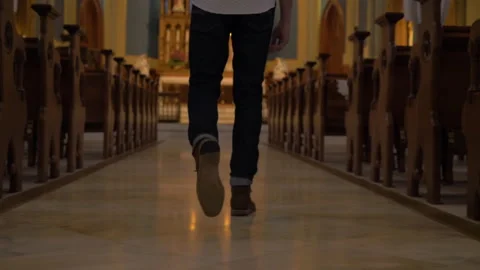 Man Walking Down Center Aisle of Church | Stock Video | Pond5