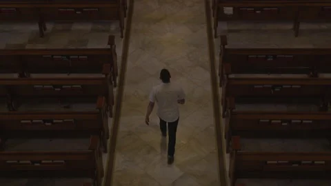 Man Walking Down Center Aisle of Church | Stock Video | Pond5