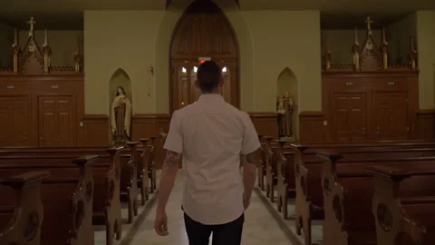 Man Walking Down Center Aisle of Church | Stock Video | Pond5