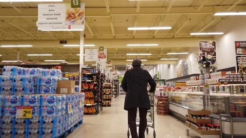 Man Walking Down Grocery Store Aisles Th... | Stock Video | Pond5