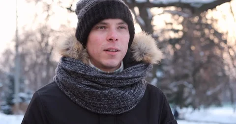 Man walking down the street on a cold wi... | Stock Video | Pond5