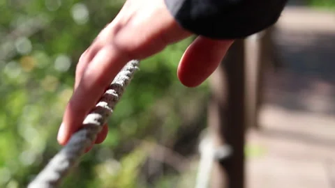 man walking on the side touching railing | Stock Video | Pond5