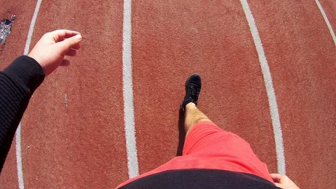 Man walking on a stadium track Pov 4k | Stock Video | Pond5