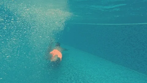 Man walking in the swimming pool on sunn... | Stock Video | Pond5