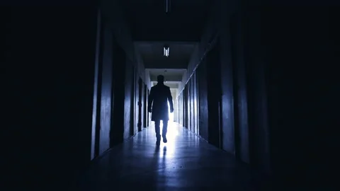 The man walking through the dark corrido... | Stock Video | Pond5