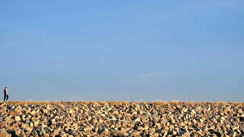 Man walking in a trail along the Boulder... | Stock Video | Pond5
