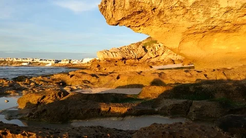 Man walking into view from behind sea co... | Stock Video | Pond5