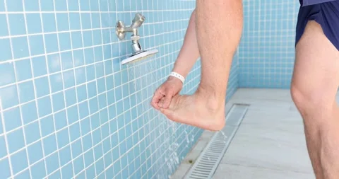 Man washes feet under the tap in shower ... | Stock Video | Pond5