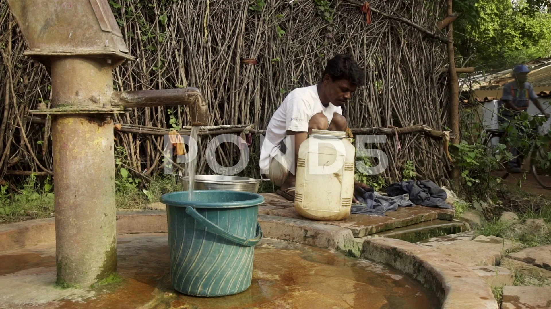 Man Washing Clothes By Hand
