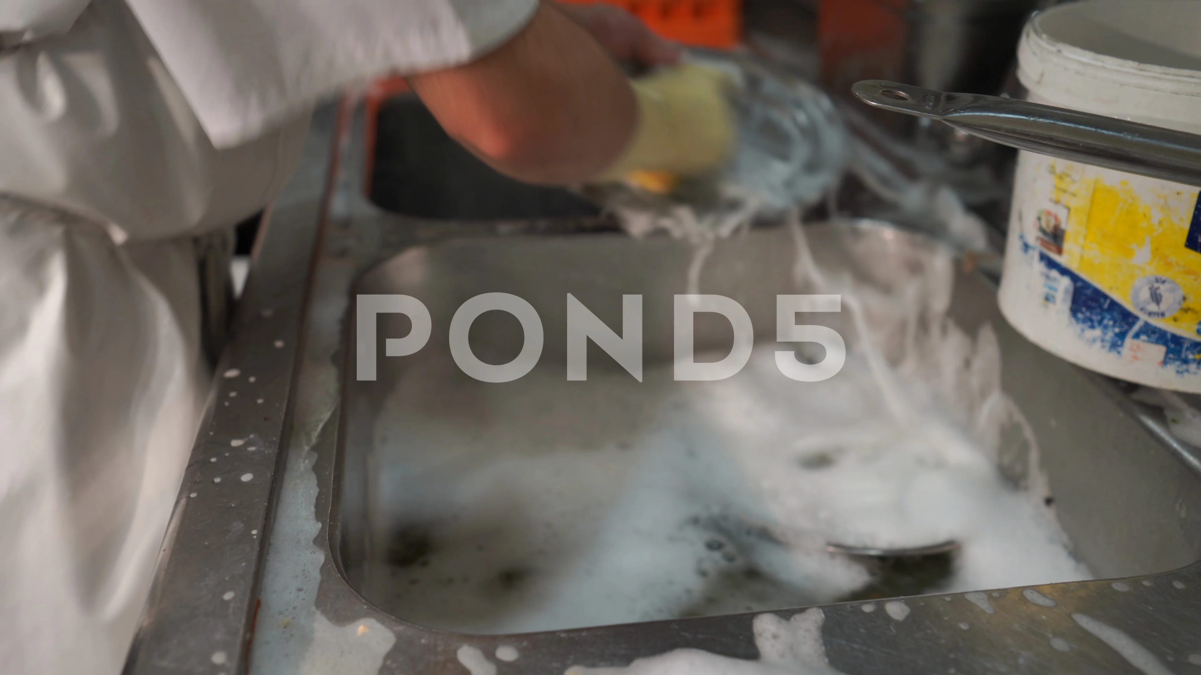 Man Washing Dishes By Hand