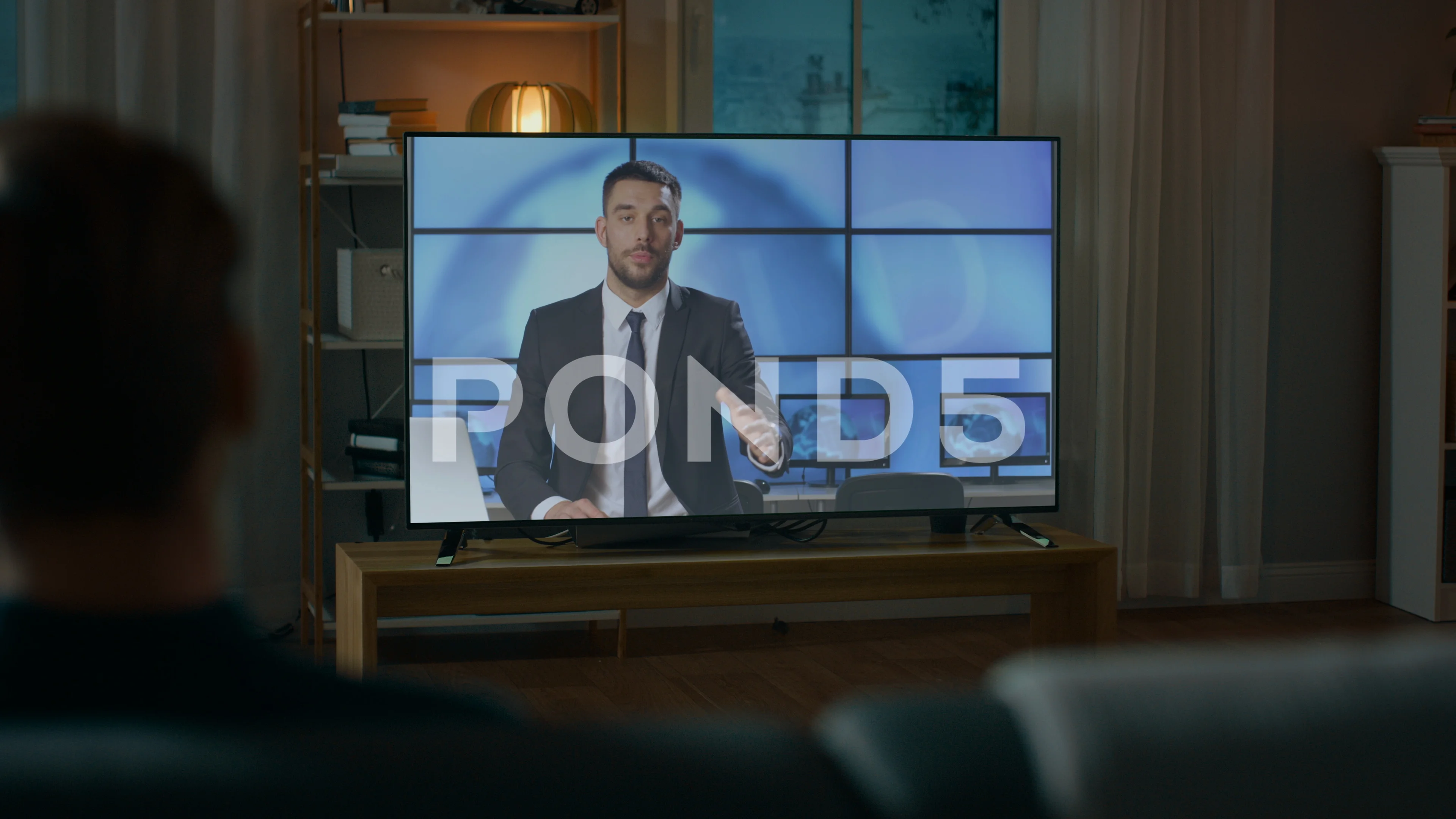 Man Watching The News