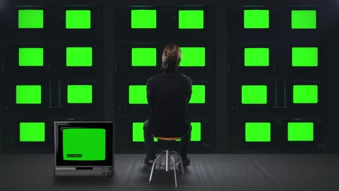 Man Watching Multiscreen Monitors Green ... | Stock Video | Pond5