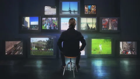 Man Watching Multiscreen Television Moni... | Stock Video | Pond5