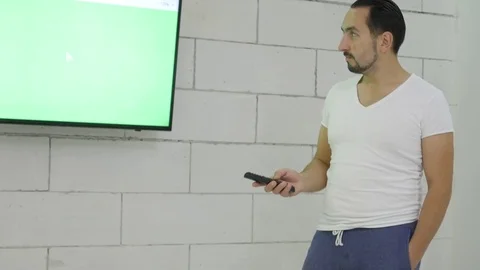 Man Watching Tv Green Screen In The Room | Stock Video | Pond5