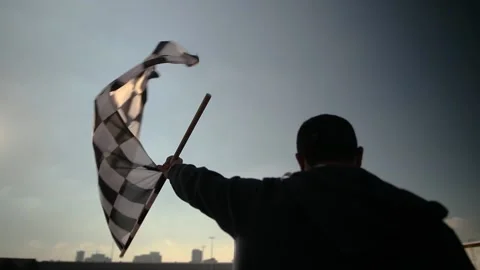man waving karting racing flag | Stock Video | Pond5