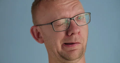 Man wear eyeglasses looking camera wink ... | Stock Video | Pond5