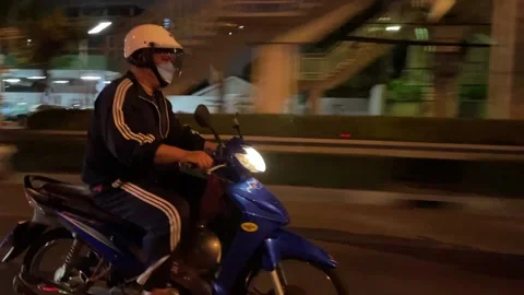 Man wear helmet riding blue motorcycle a... | Stock Video | Pond5