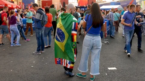 Man wearing a flag of all countries flag... | Stock Video | Pond5