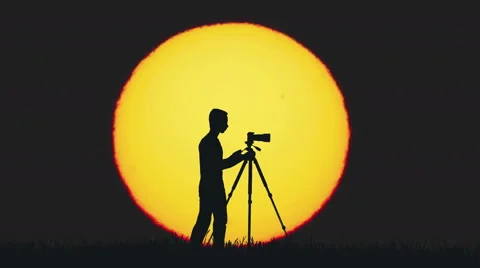 The man work with the camera on a backgr... | Stock Video | Pond5