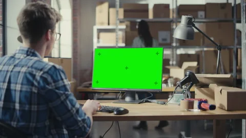 Man Working on Computer with Green Scree... | Stock Video | Pond5